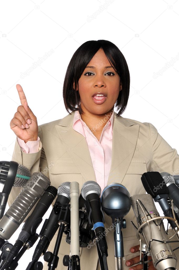 Woman Speaking Behind Microphones — Stock Photo © ginosphotos1 #15391301