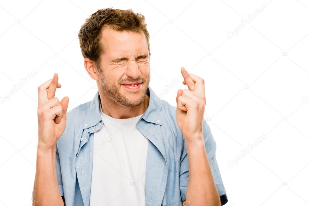 Young man making wish fingers crossed — Stock Photo © AILA_IMAGES #27409643