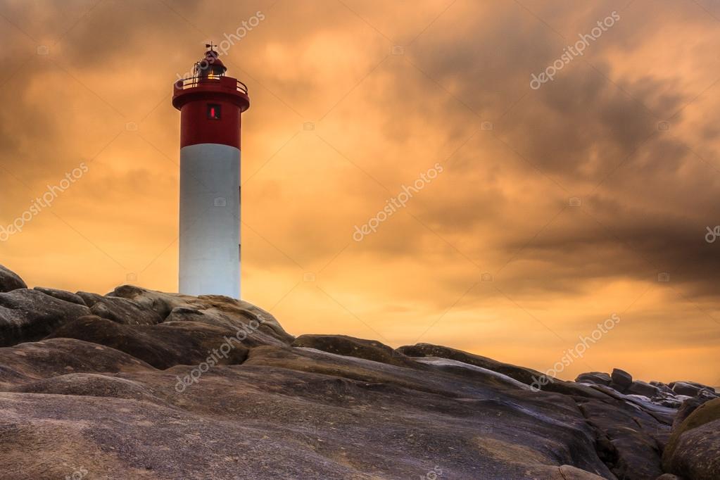 Lighthouse on Rocks — Stock Photo © Riaanvdberg #35221031