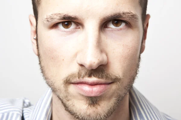 Portrait of a young beautiful man, serious face expression Stock Photo ...