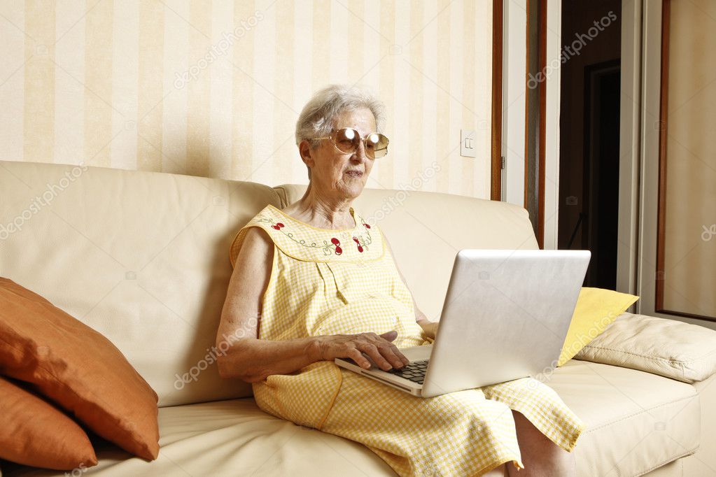 Elder lady with laptop — Stock Photo © tommasolizzul #13763450