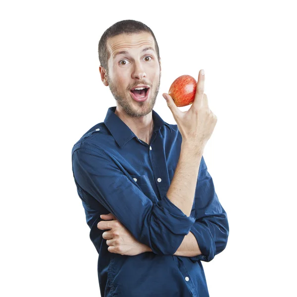 Cheerful beautiful man eating apple, isolated over white background ...