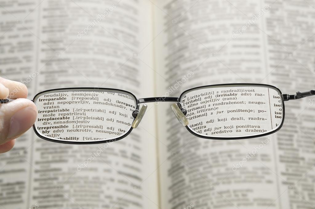 Seeing dictionary through glasses Stock Photo by ©grufnar 38567705