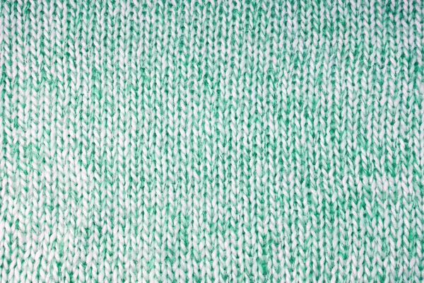 Close up background of knitted wool fabric with dots pattern. Bright ...