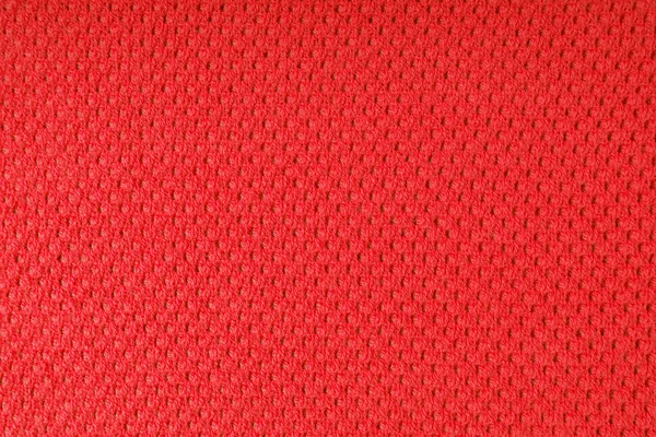 Close up background of knitted wool fabric with dots pattern. Bright ...