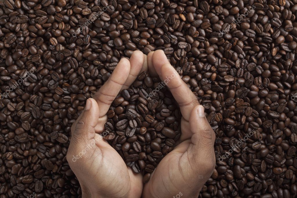 Human hands and coffee beans — Stock Photo © kozzi2 #18753747