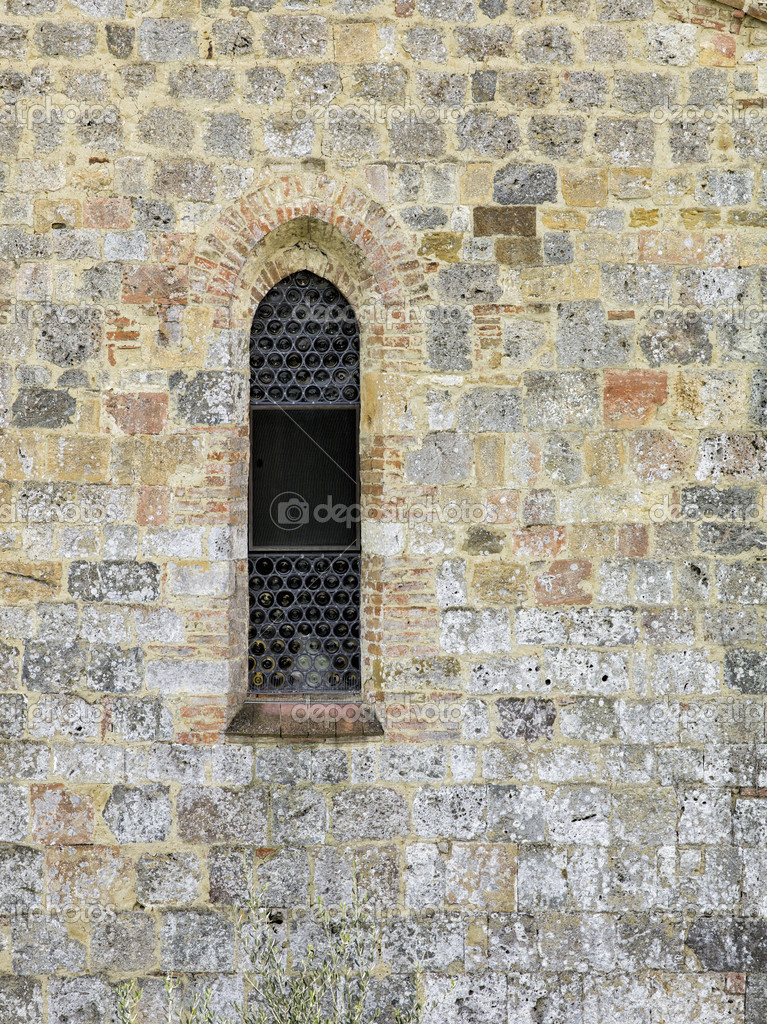 Arch window on stone wall of a tuscan church — Stock Photo © kozzi2 ...