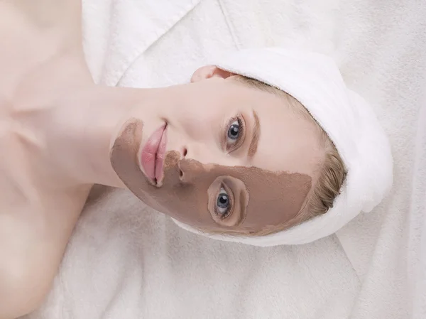 A lady with a mud mask on her face - Stock Image - Everypixel