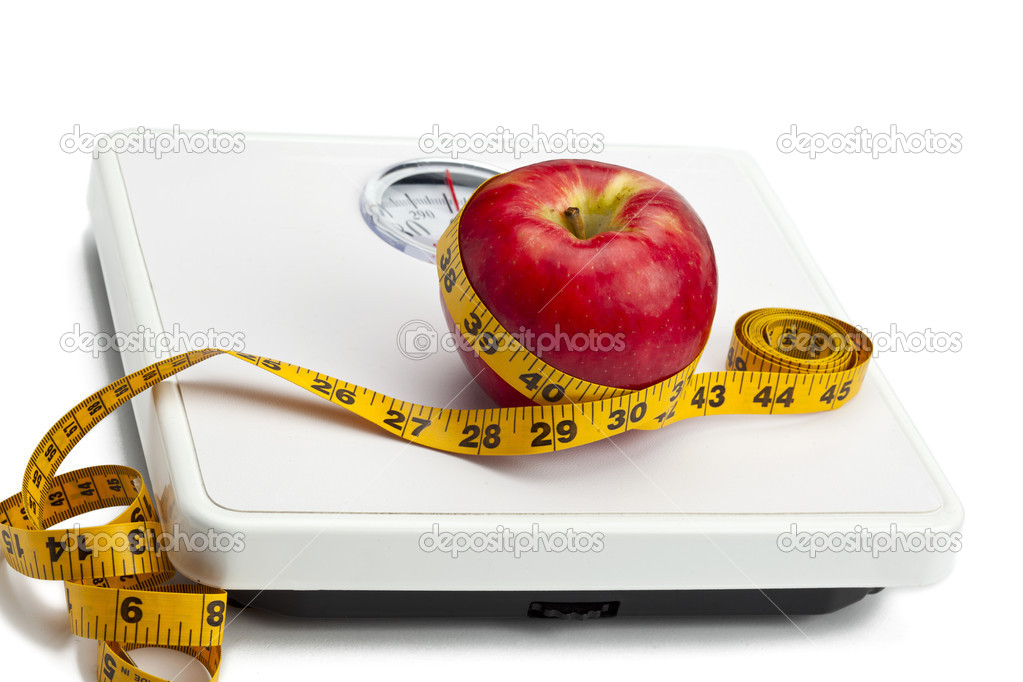 Apple with measuring tape on weight scale — Stock Photo © kozzi2 #20324683