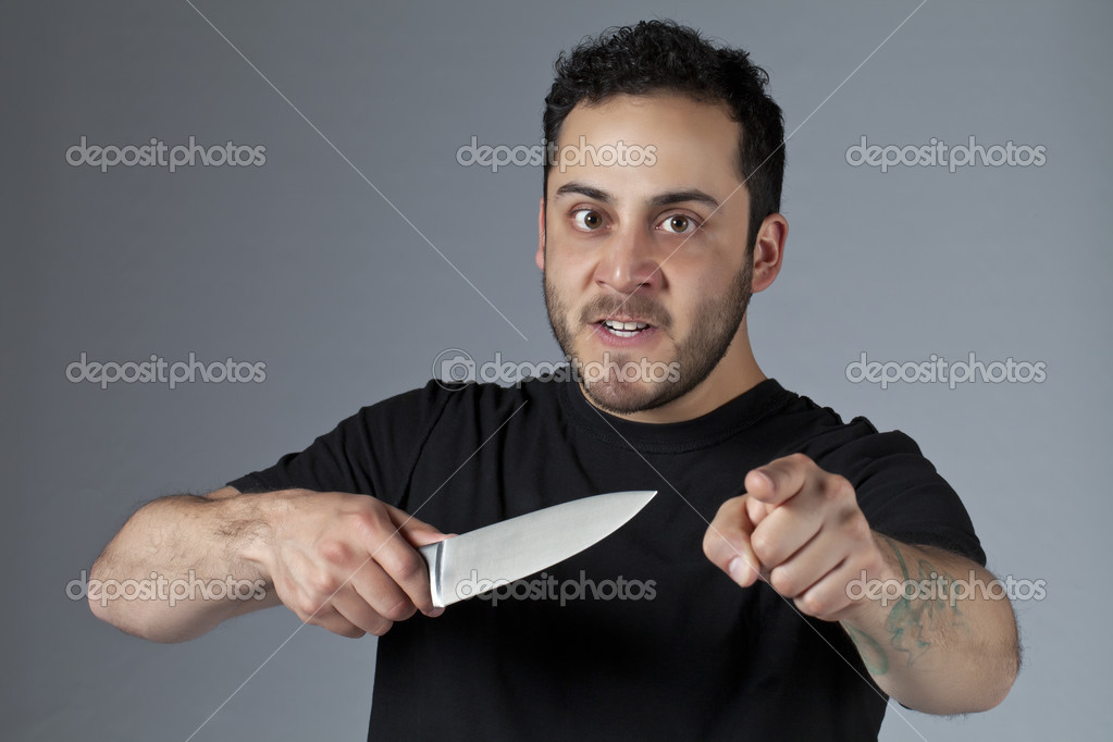 An angry man holding a knife ⬇ Stock Photo, Image by © kozzi2 #24229597