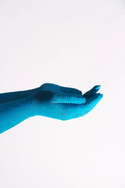 Blue colored hands holding powder paint — Stock Photo © iphemant #51100579