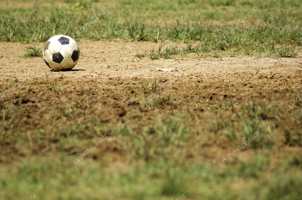 Old Soccer Ball. Poor school soccer field. Charity. — Stock Photo ...