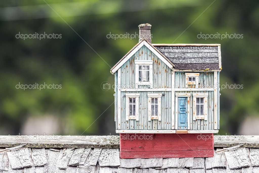 Miniature house on a rooftop Stock Photo by ©steho 51017813