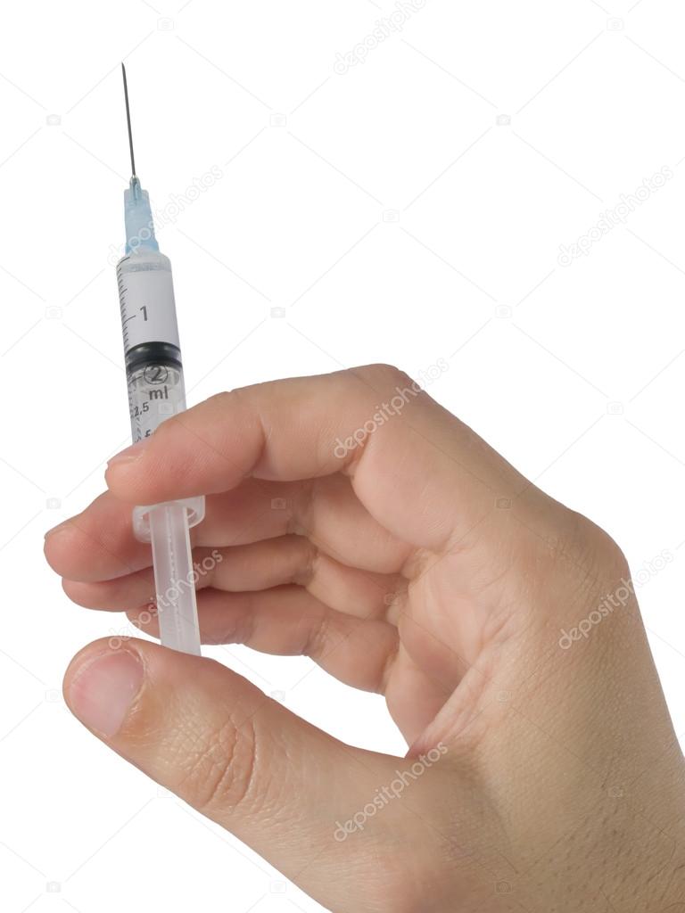 Hand holding syringe Stock Photo by ©Lusoimages 13299948