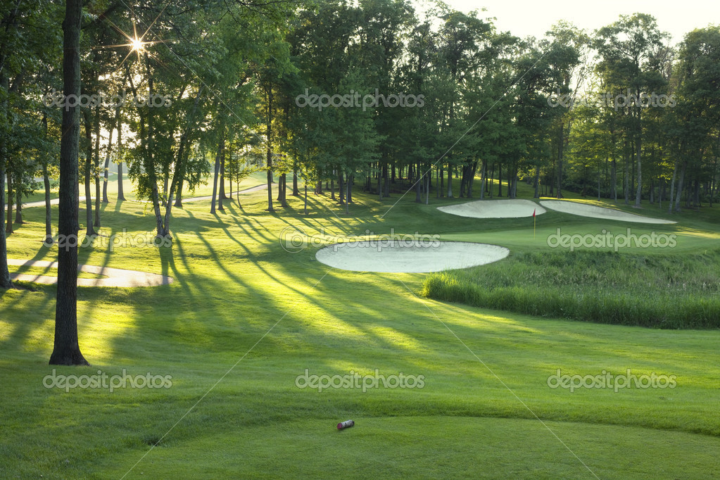 Golf green and tee box in late afternoon sunlight — Stock Photo ...