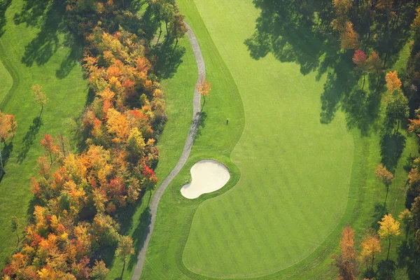 Aerial view of golf course during autumn - Stock Image - Everypixel