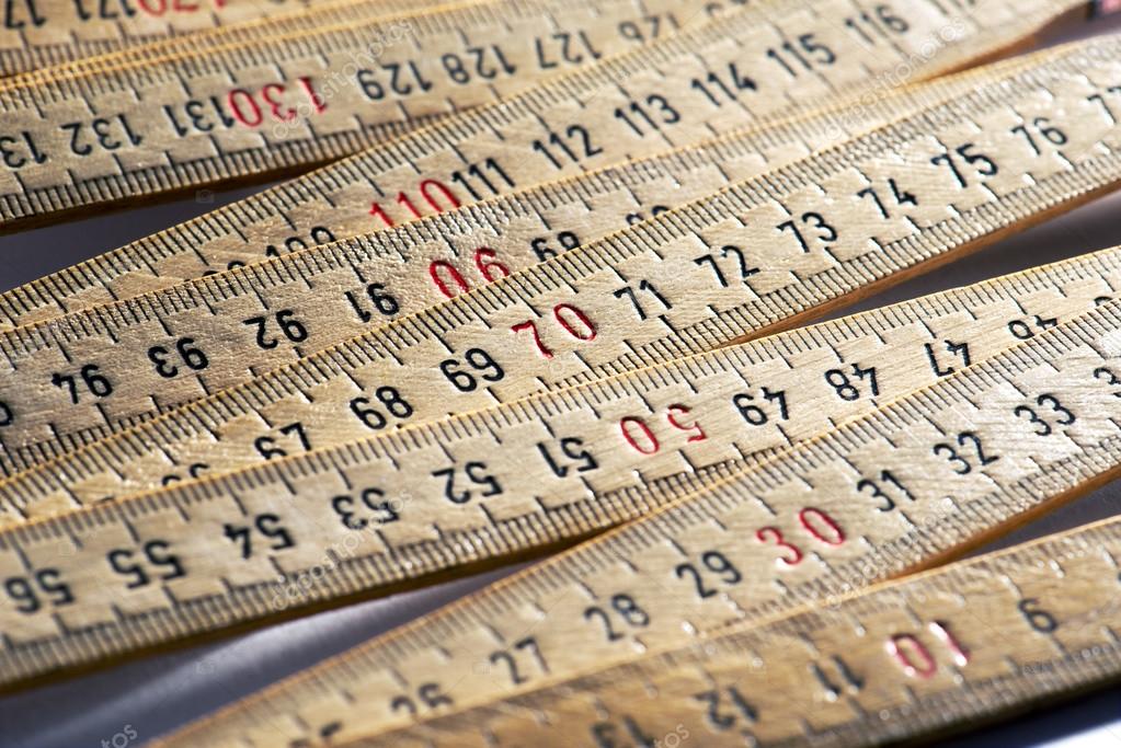 Background of wooden meter rulers Stock Photo by ©PHOTOLOGY1971 43571113