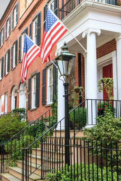 Colonial Brick Architecture with American Flags - Stock Image - Everypixel
