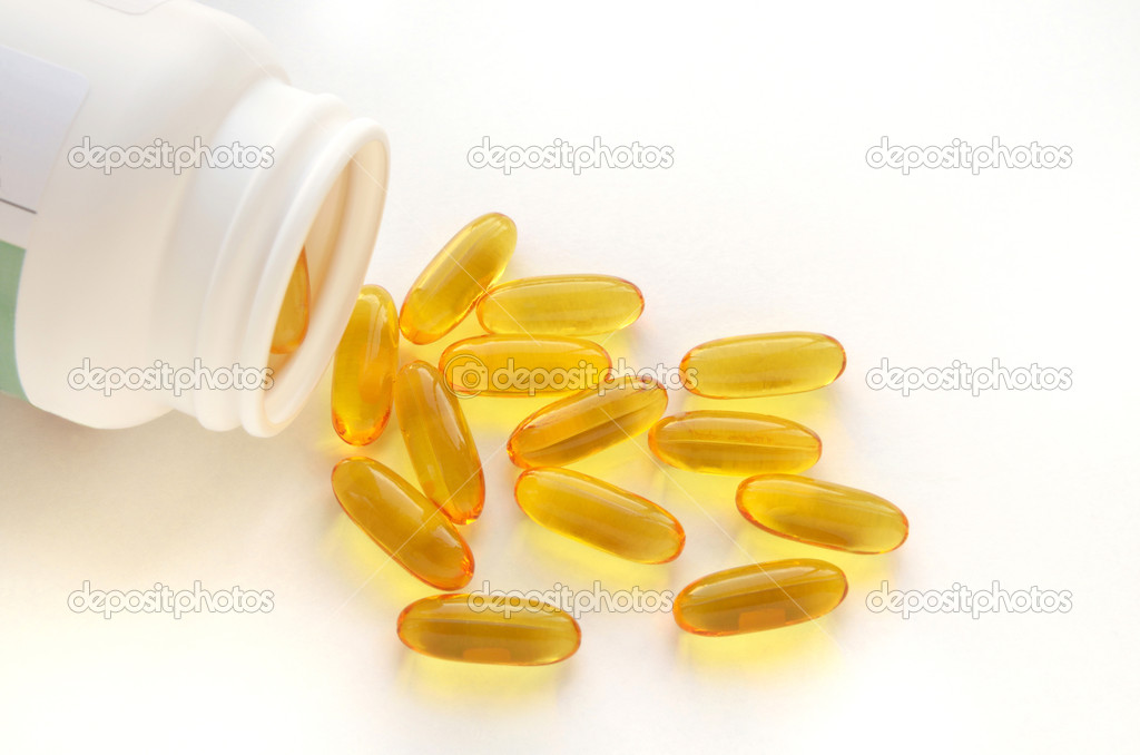 Fish oil capsules and container Stock Photo by ©florinoprea1 13518770