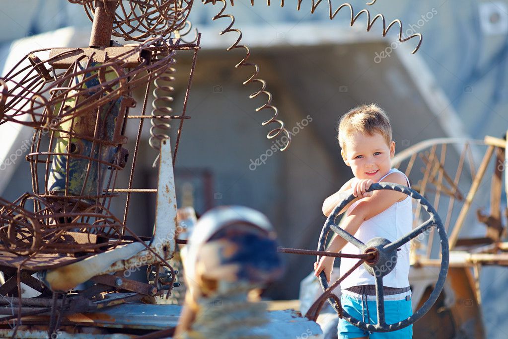 Cute kid pretends driving imaginary vehicle Stock Photo by ...