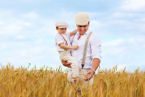 father and son, farmers on wheat field - Stock Image - Everypixel