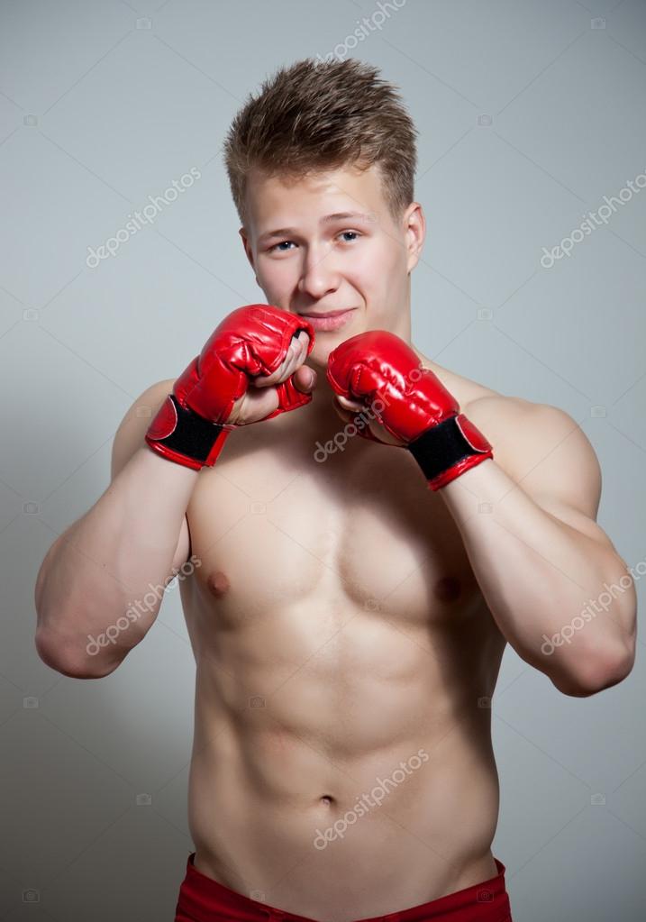 Young Boxer fighter on studio Stock Photo by ©zoloto8888 24907735