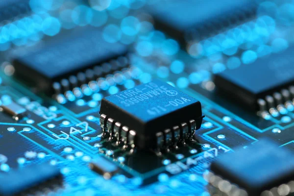 Infromation technology computer board with transistor and blue light ...