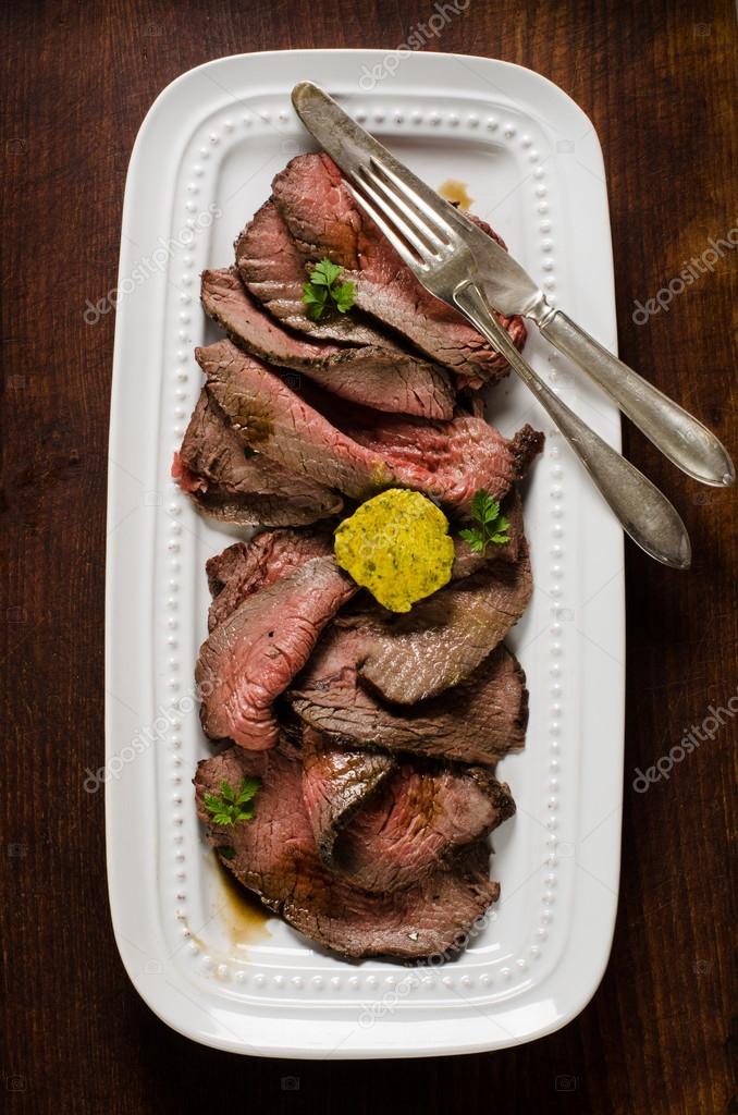 Juicy roast beef slices Stock Photo by ©eugena-klykova 40155789