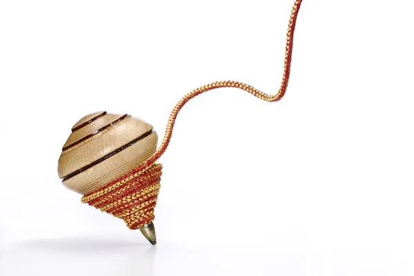 Wood spinning top on white background and string. Stock Photo by ...
