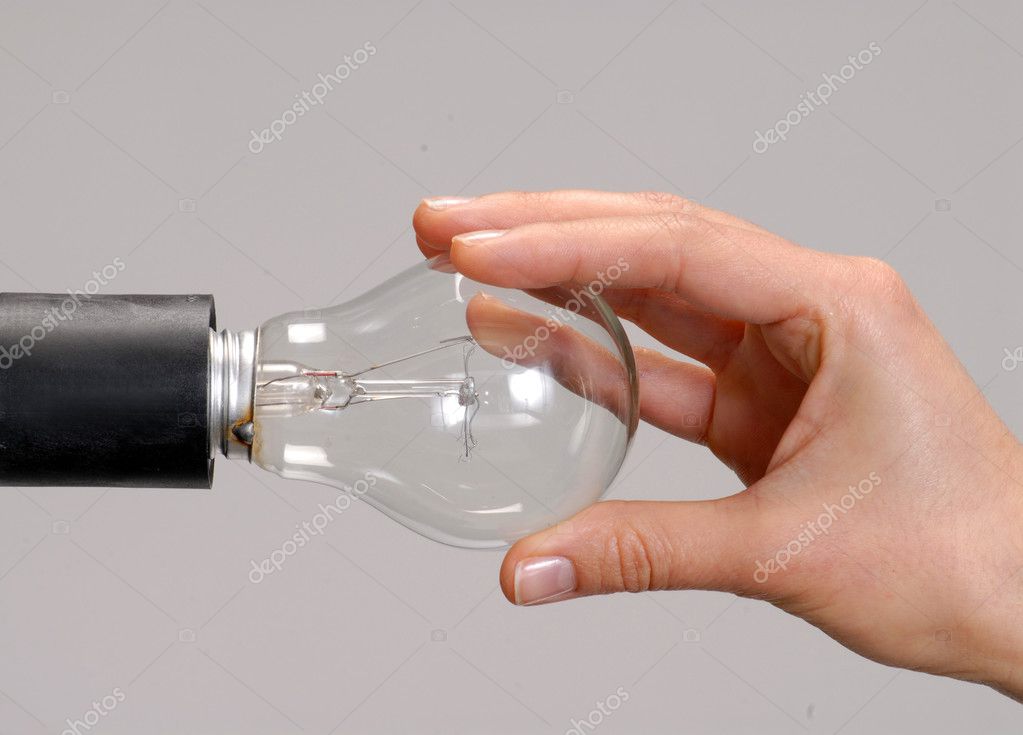 Changing a light bulb. — Stock Photo © Gustavo_Andrade #31921903