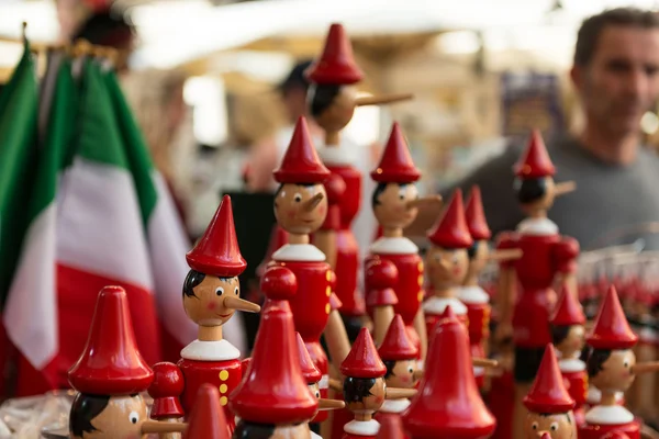 Wooden Puppet Set Long Nose Red Hats — Stock Photo © Eloy_CM #367964956