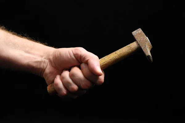 Hands holding hammer and pliers. Isolatad on black background — Stock ...