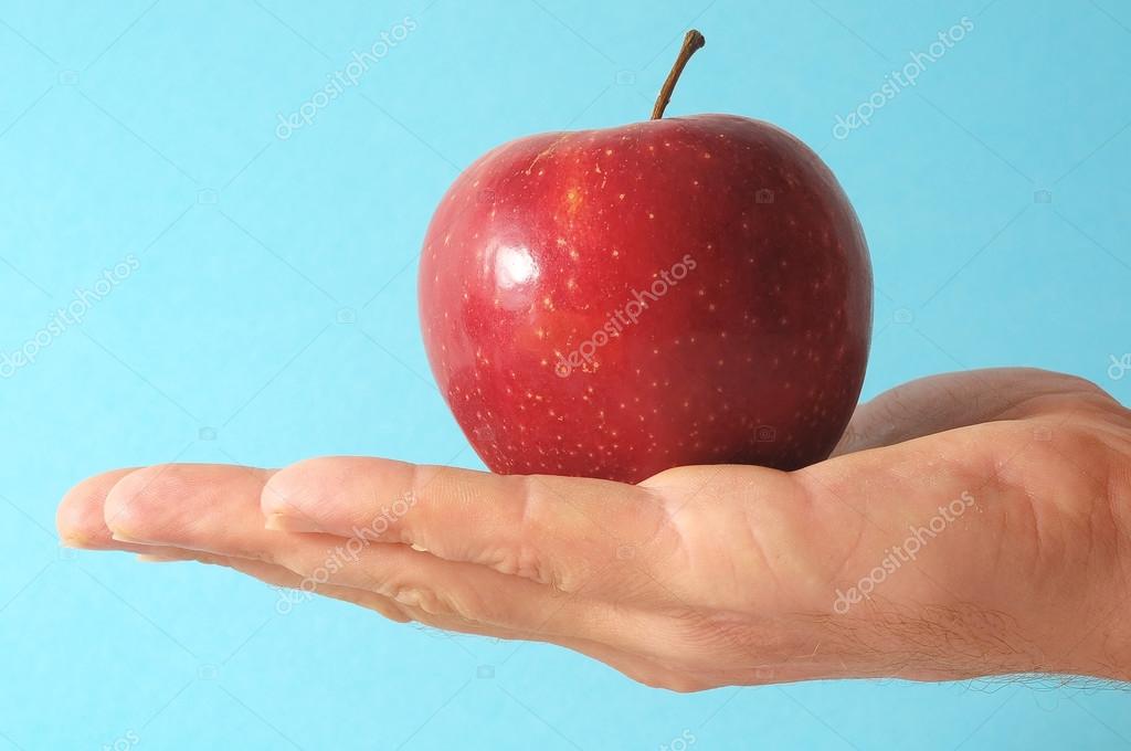 Apple on the Hand Stock Photo by ©underworld1 44311511