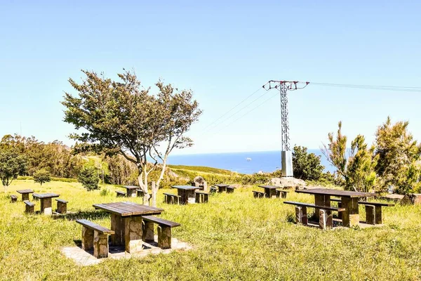 beautiful landscape with a picnic area with tables and benches - Stock ...