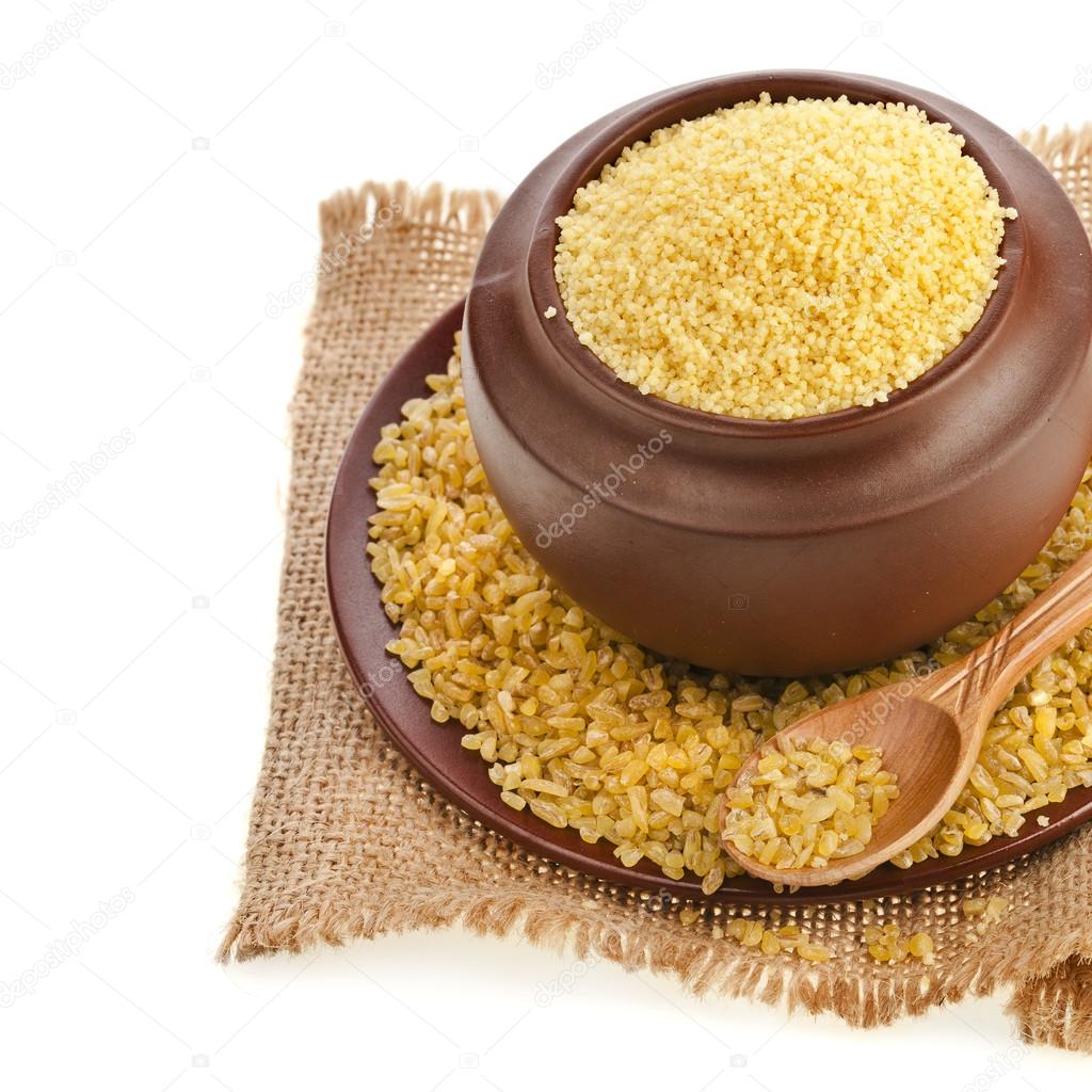 Porridge kuskus couscous with bulgur in a clay pot isolated on white ...