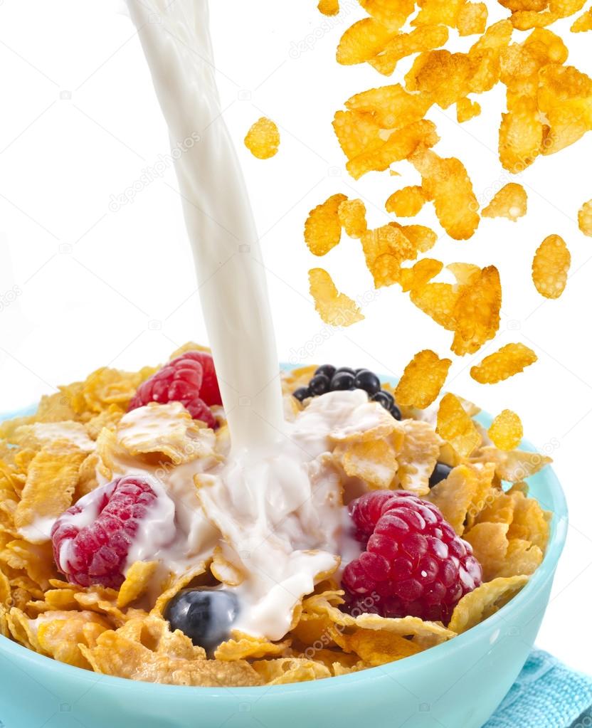 Falling corn flakes with fresh berries and pouring milk Stock Photo by ...