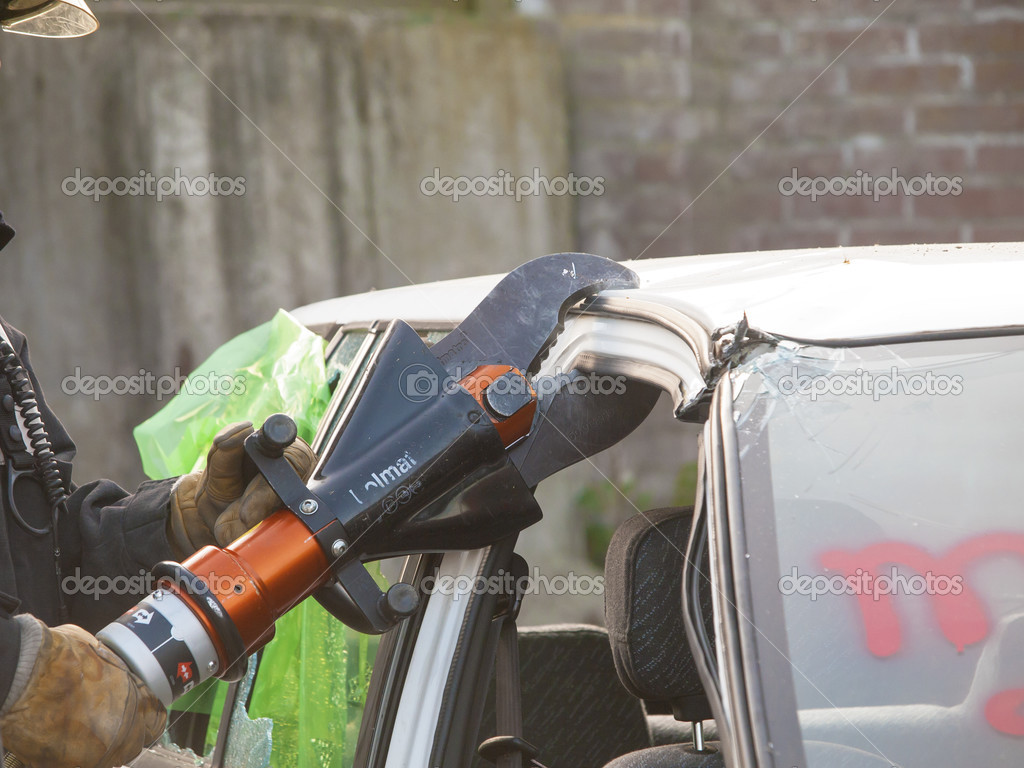 Firefighters cut open the roof of a car – Stock Editorial Photo ...