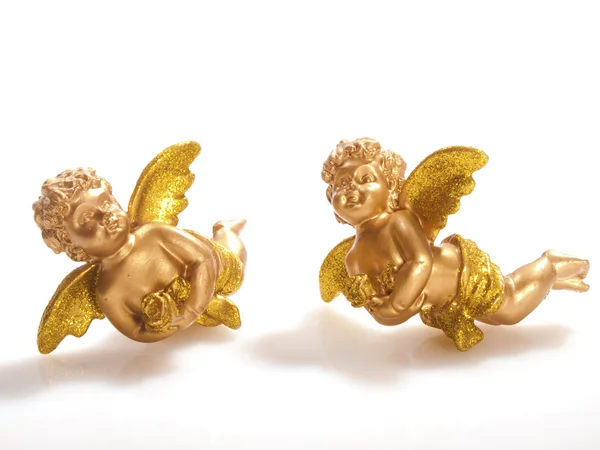 Two golden cherubs and white background Stock Photo by ©kees59 37570369