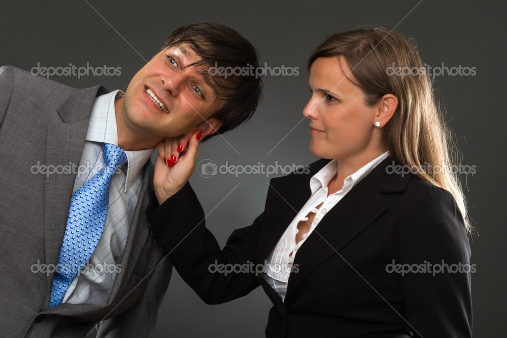 Businesswoman pulling a businessman ear Stock Photo by ©jinga80 13878149