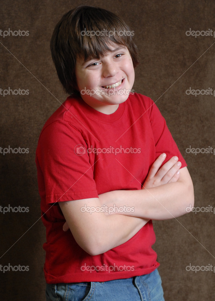 Twelve year old boy happy and laughing — Stock Photo © willeecole #24416045