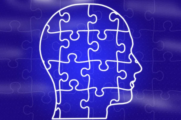 Puzzle in head on blue background - Stock Image - Everypixel