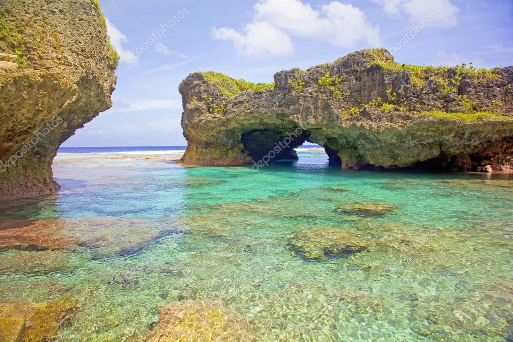Natural arch over one of the Limu pools, Niue Island, South Pacific ...