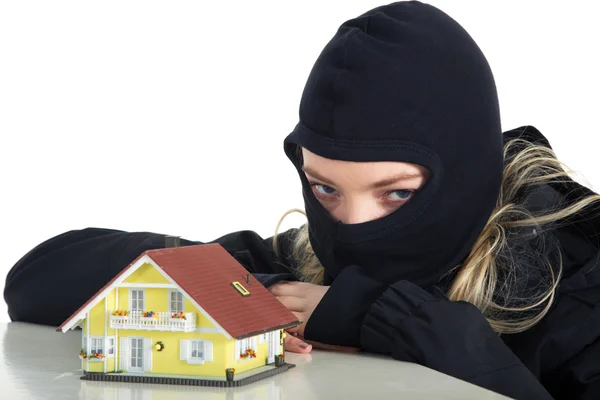 Thief girl with house model Stock Photo by ©Nick_Freund 28516741