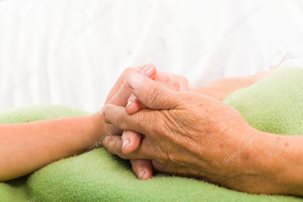 Caring nurse holding hands Stock Photo by ©Lighthunter 34761293