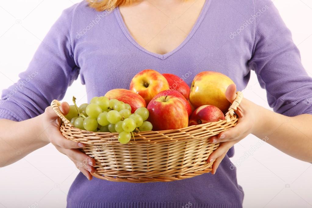 Beautiful woman with a fruit basket.white background — Stock Photo ...