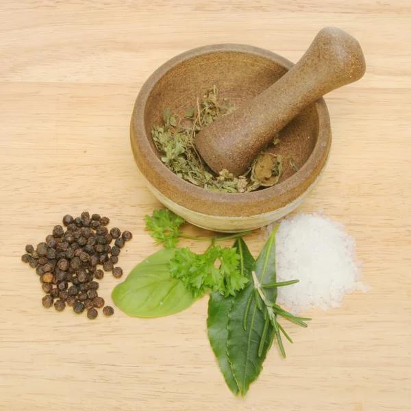 Herbs, pepper, salt and pestle and mortar - Stock Image - Everypixel