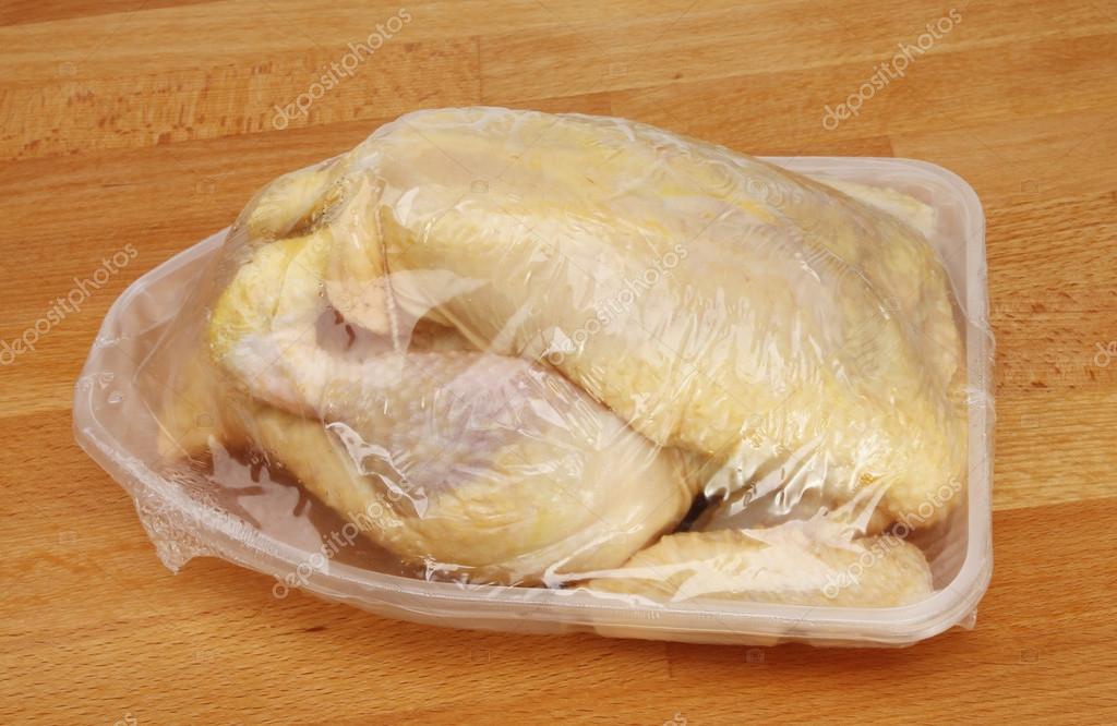 Whole chicken in packaging — Stock Photo © griffin024 #19835359