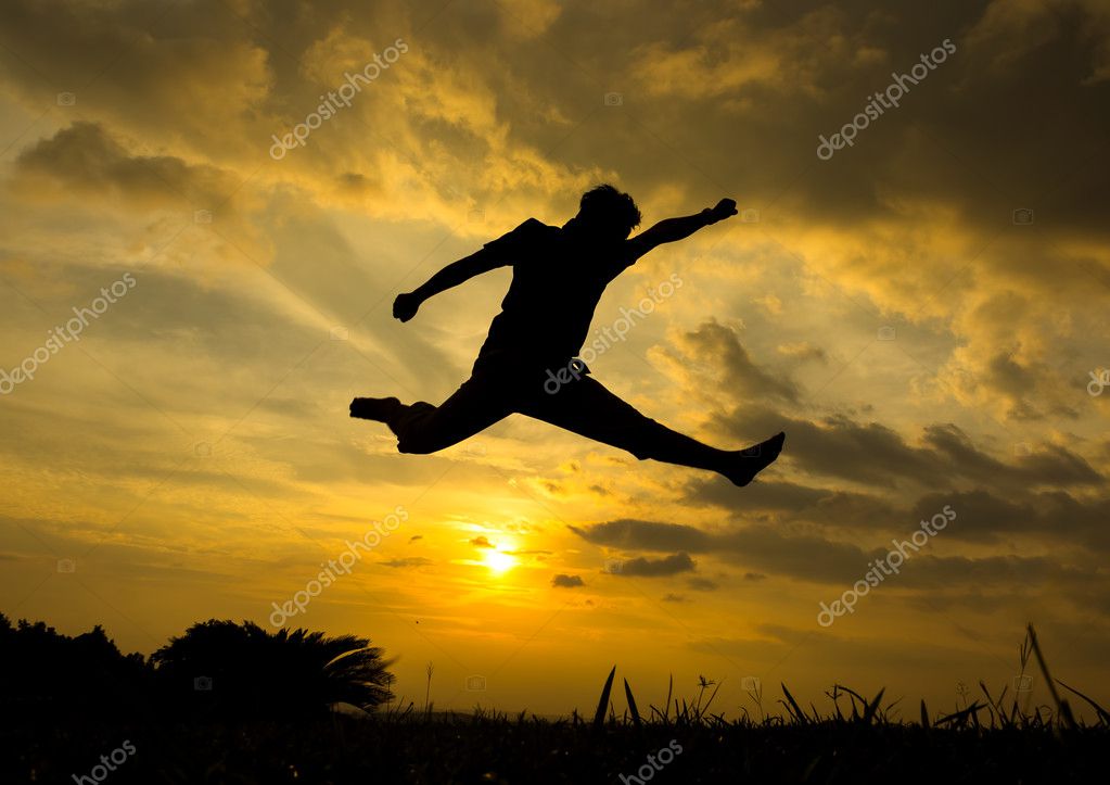Silhouette of man jumping during sunset — Stock Photo © mrfiza #18796471