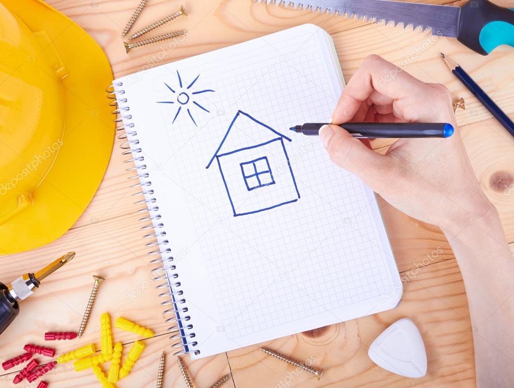Drawing house and different tools on a wooden background Stock Photo by ...