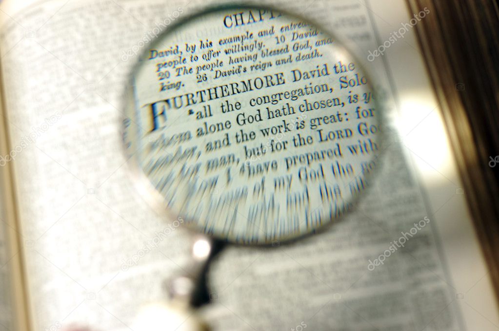 The "God" word comes bigger under magnifier on a bible page — Stock ...